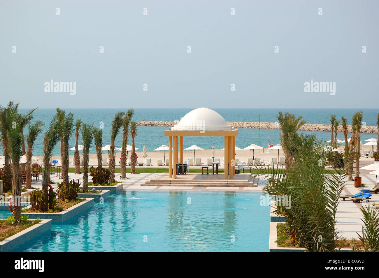 Swimming pool and beach of luxury hotel, Dubai, UAE Stock Photo - Alamy