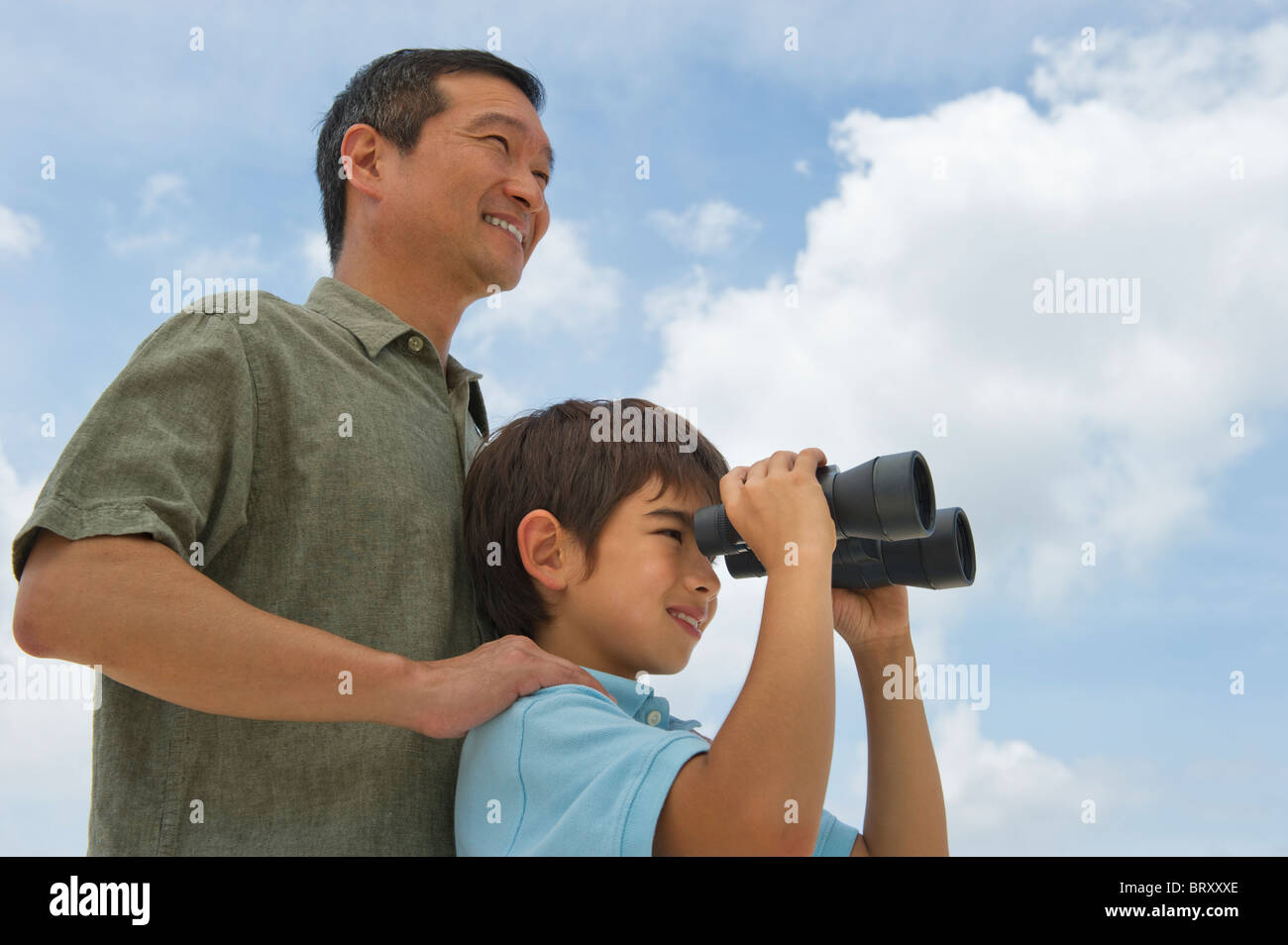 Group people looking through binoculars hi-res stock photography and ...