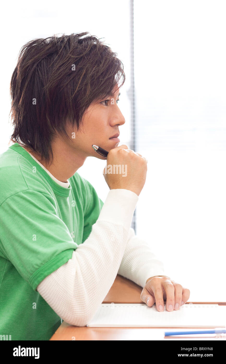 Young man studying in classroom Japan Stock Photo - Alamy