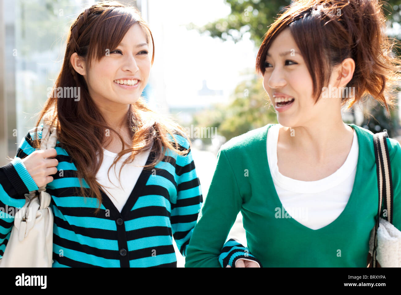 Young women window shopping Japan Stock Photo - Alamy