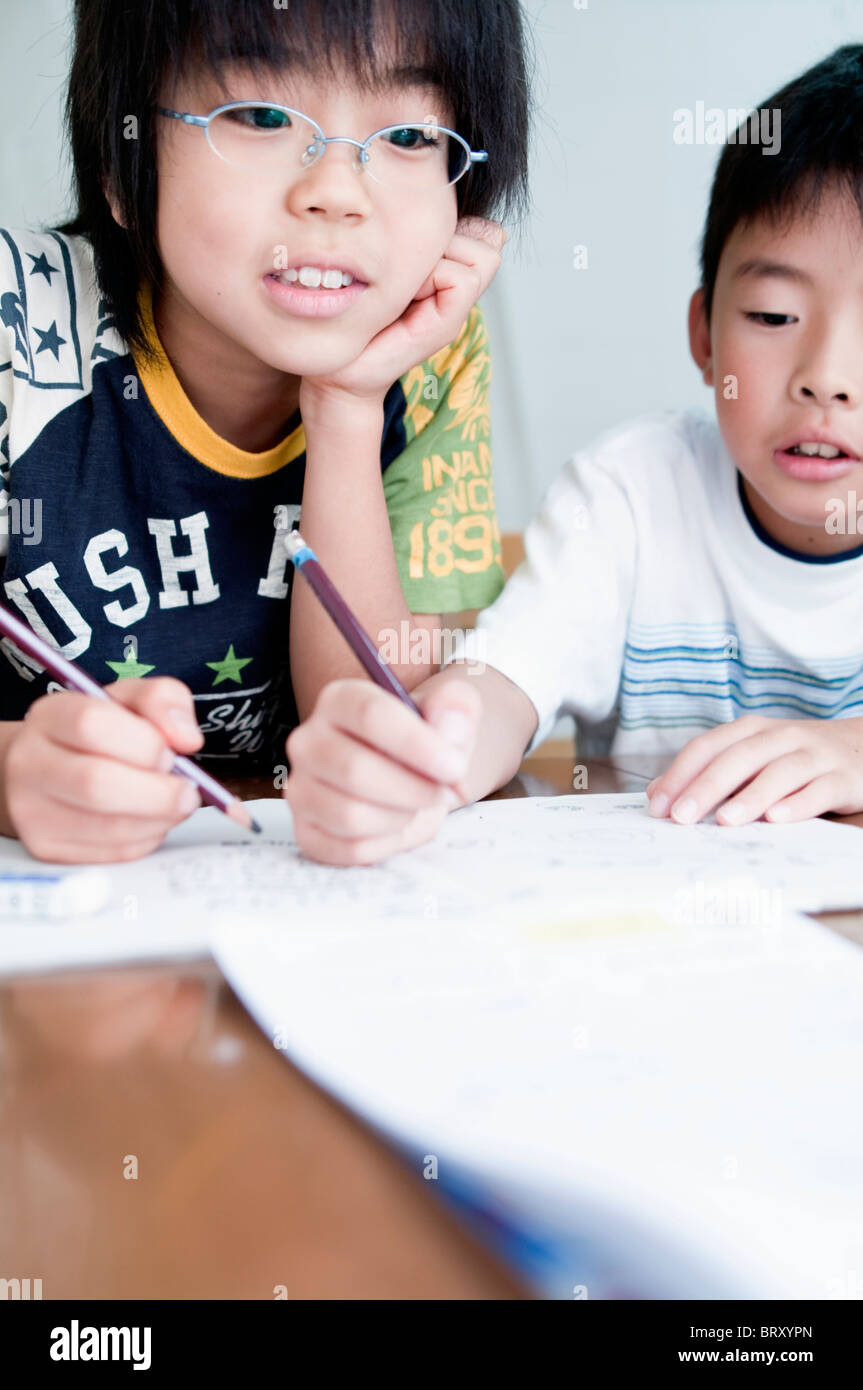 Kids doing homework Japan Stock Photo - Alamy