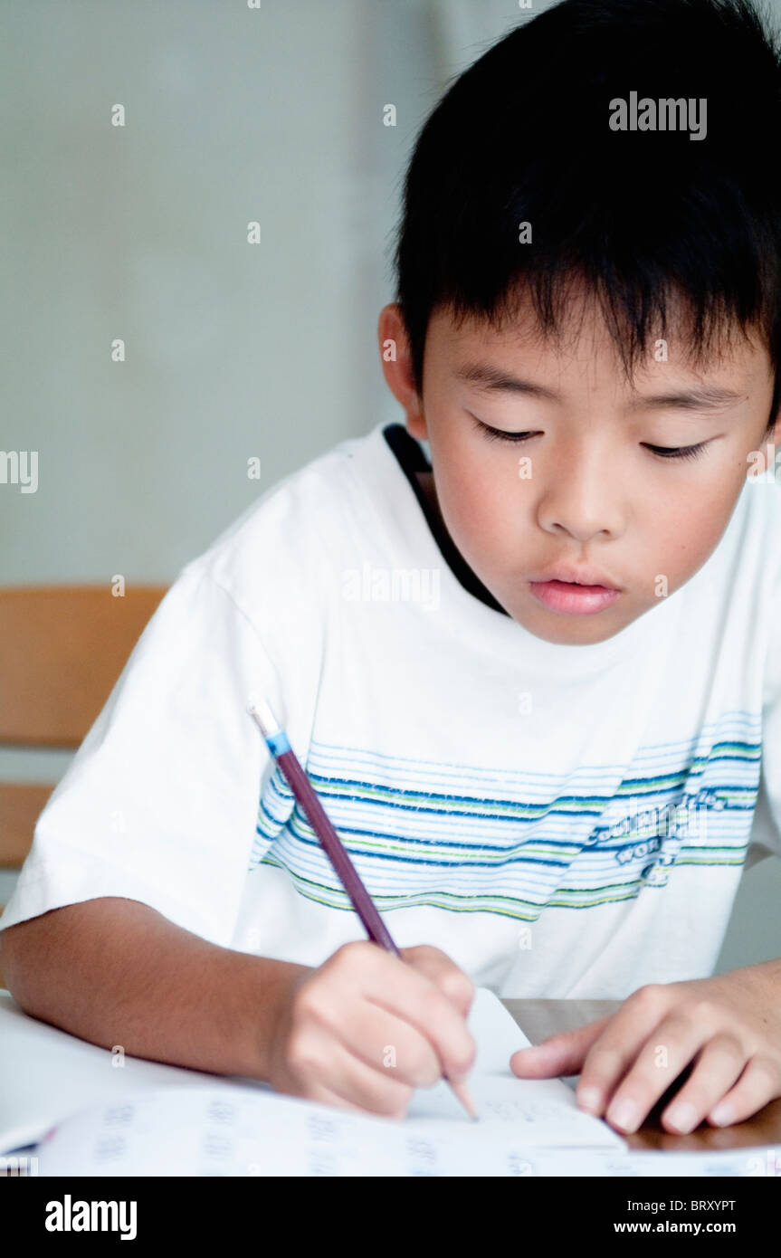 Boy doing homework Japan Stock Photo - Alamy