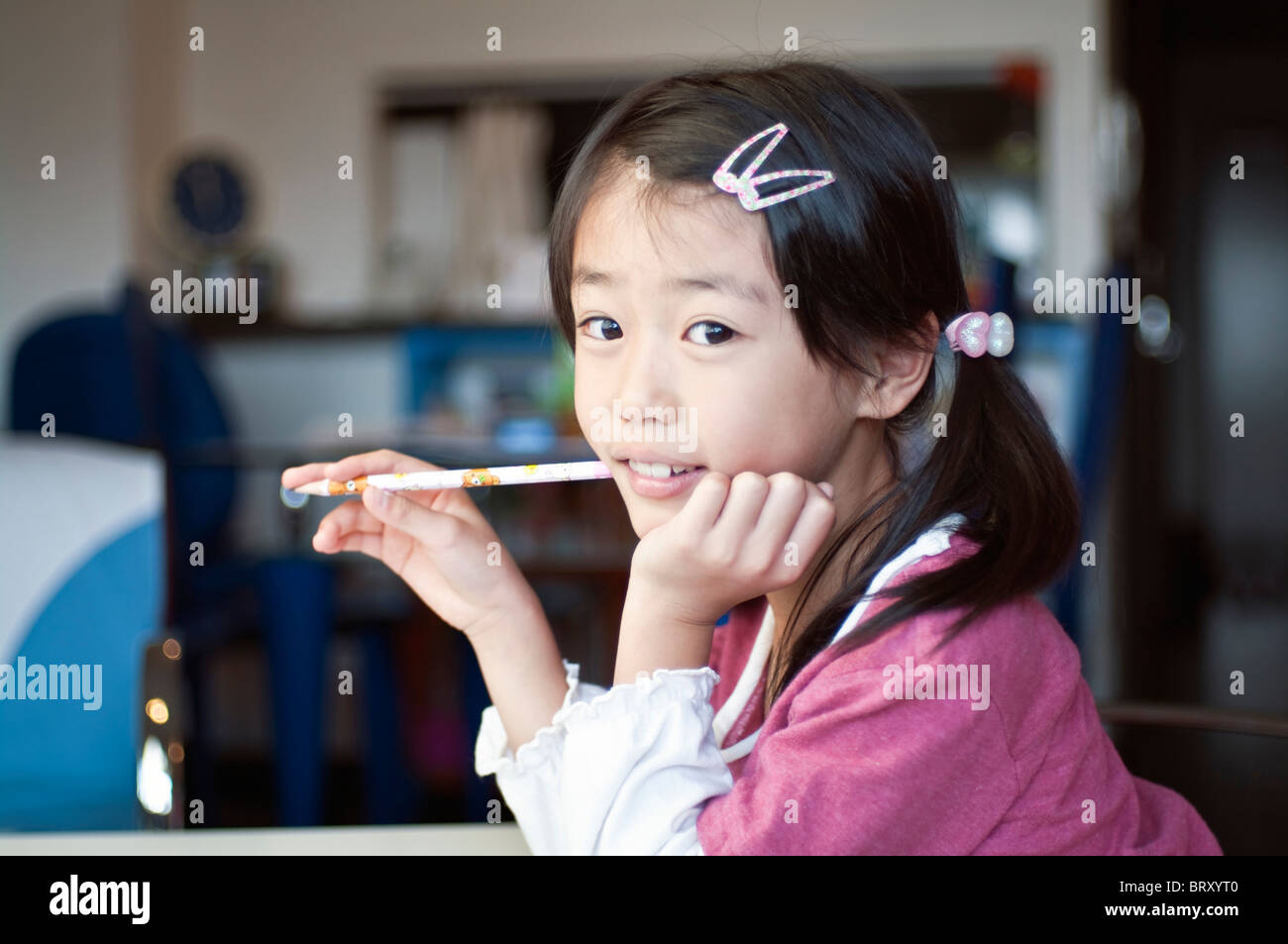 Girl doing homework Japan Stock Photo - Alamy