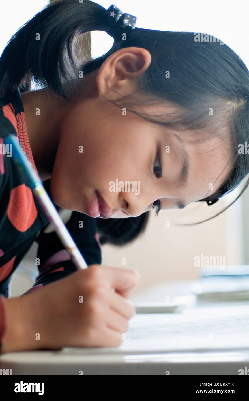 Girl doing homework Japan Stock Photo - Alamy