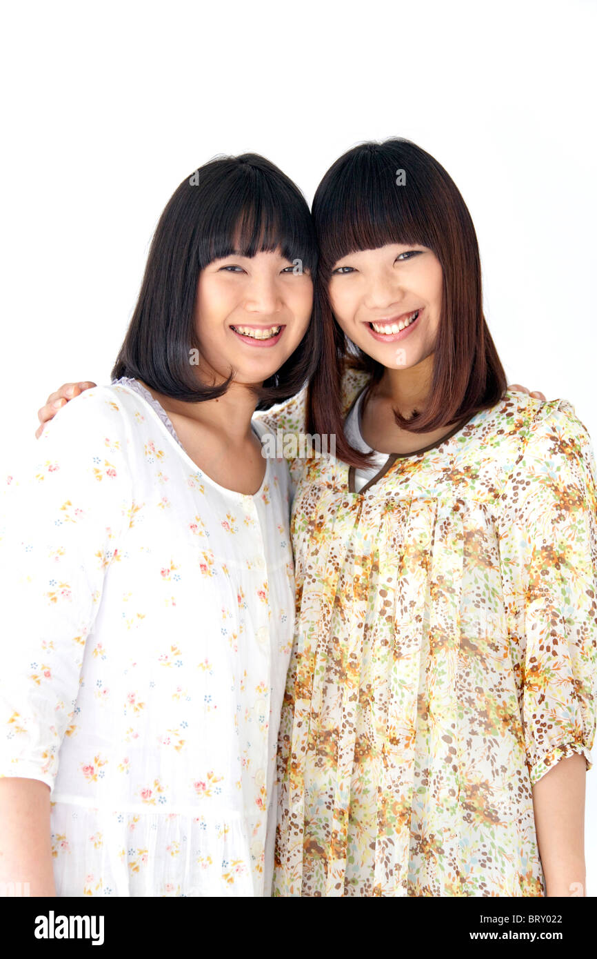 Two Young Women Cuddling Holding Shoulders Stock Photo - Alamy Two Young Women Cuddling Holding Shoulders Stock Photo - Alamy