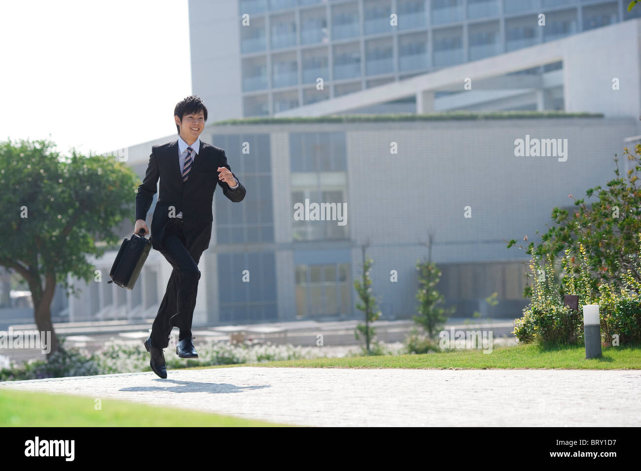 A running businessman Stock Photo - Alamy