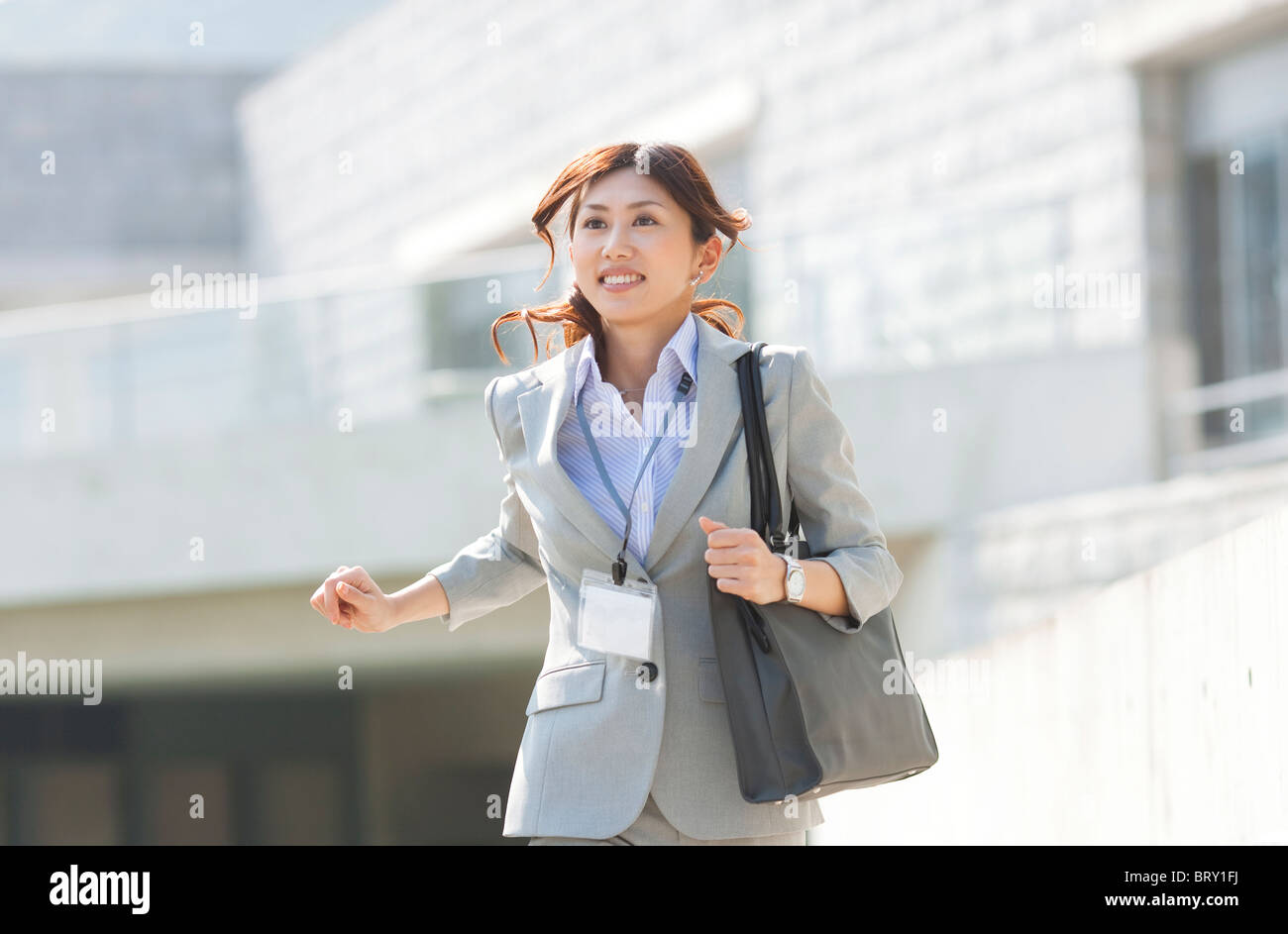 A running business woman Stock Photo - Alamy
