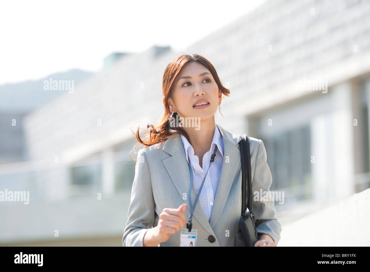 A running business woman Stock Photo - Alamy