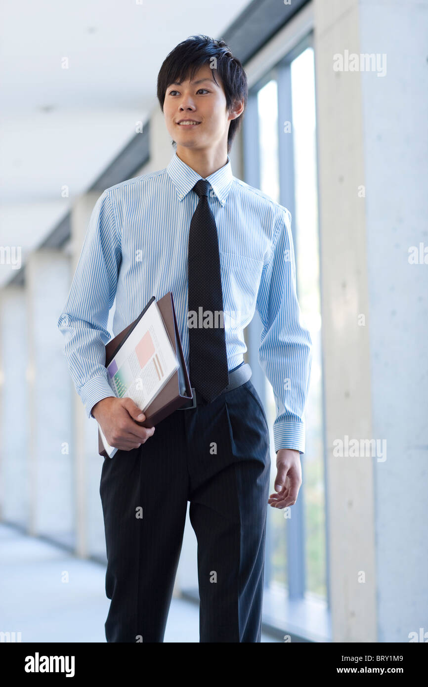 A businessman holding file Stock Photo - Alamy