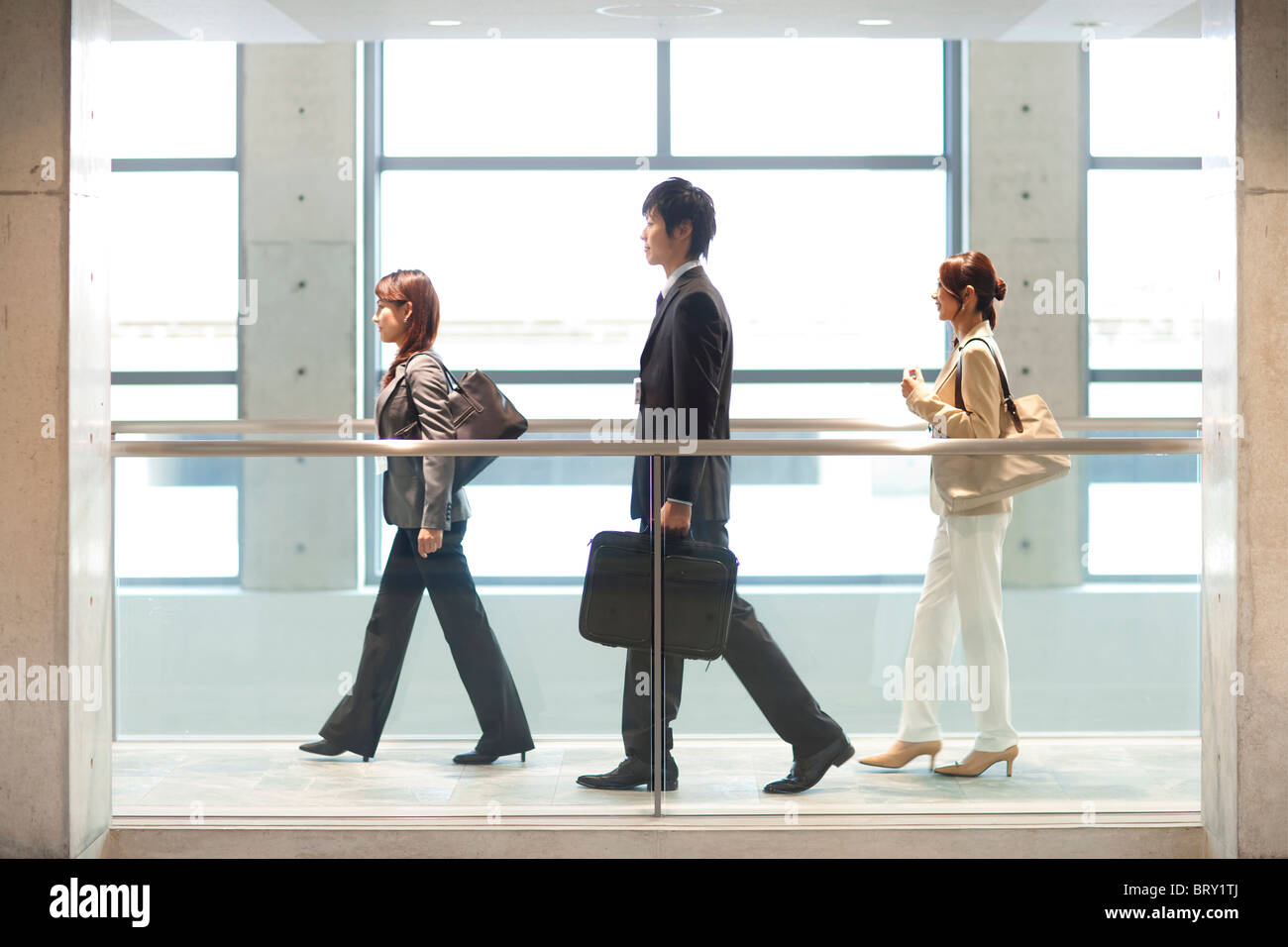 Business people walking Stock Photo - Alamy