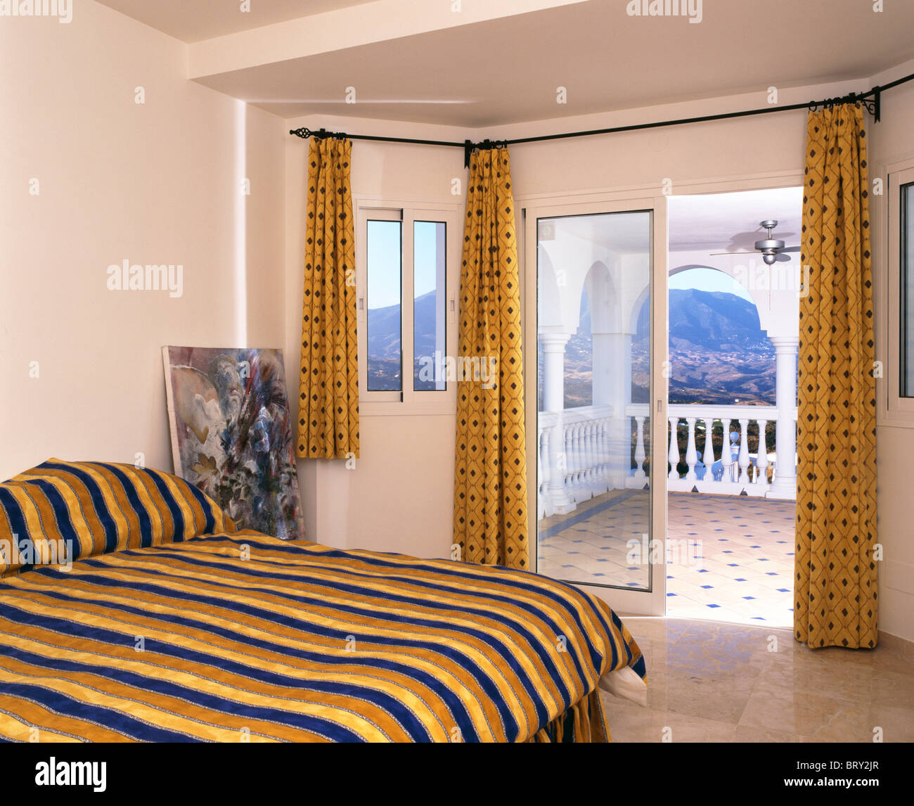 Yellow striped bed cover on bed hi-res stock photography and images - Alamy