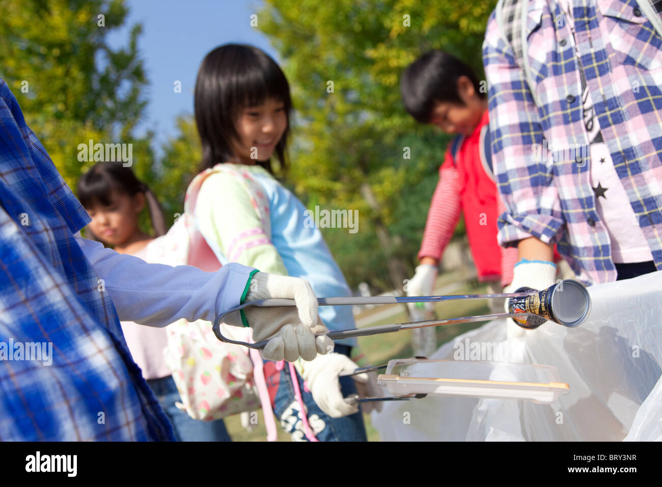 School children picking garbage in park Stock Photo - Alamy