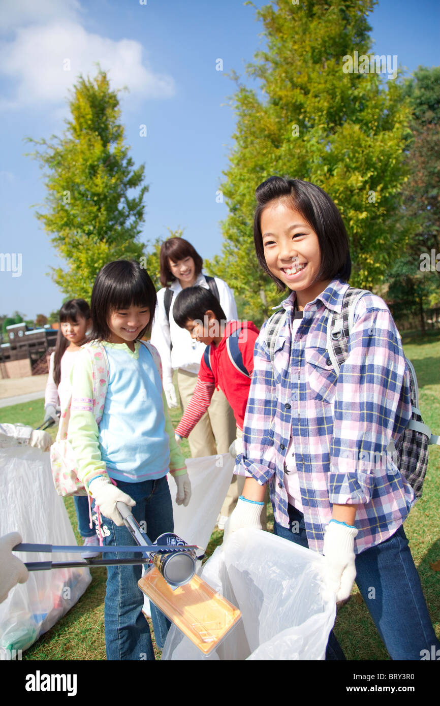 School children picking garbage in park Stock Photo - Alamy