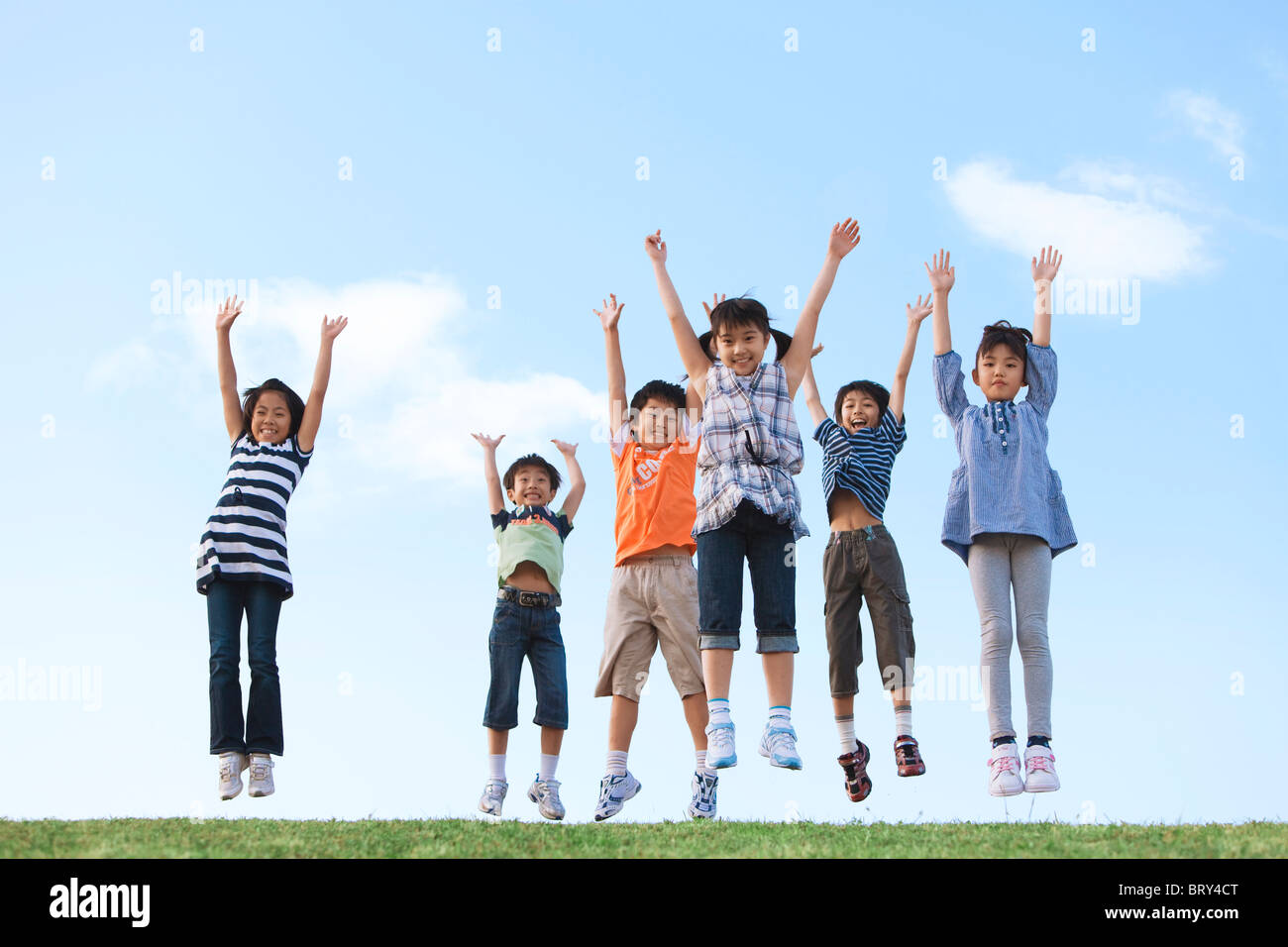 School children jumping hi-res stock photography and images - Alamy