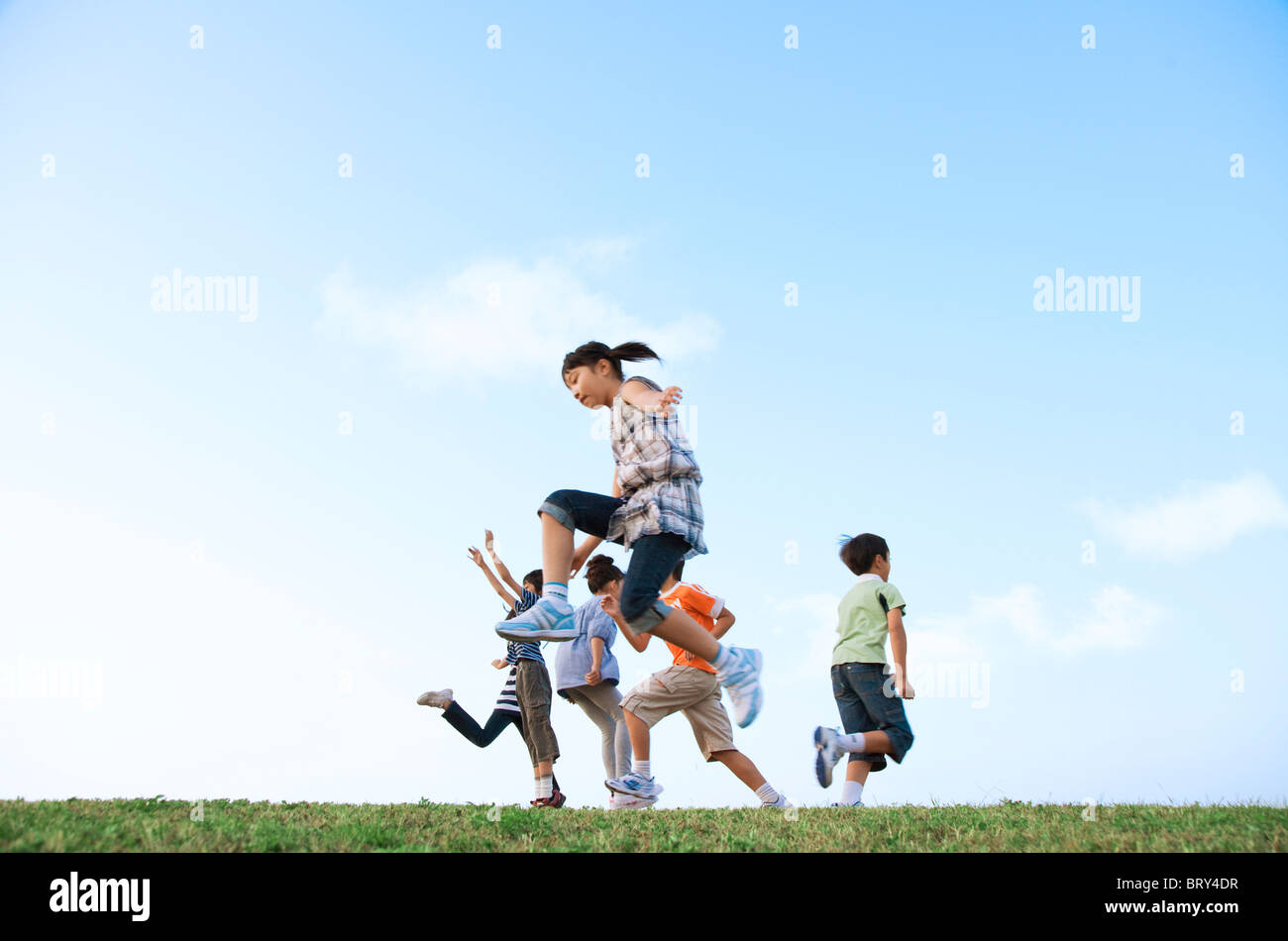 School children jumping hi-res stock photography and images - Alamy