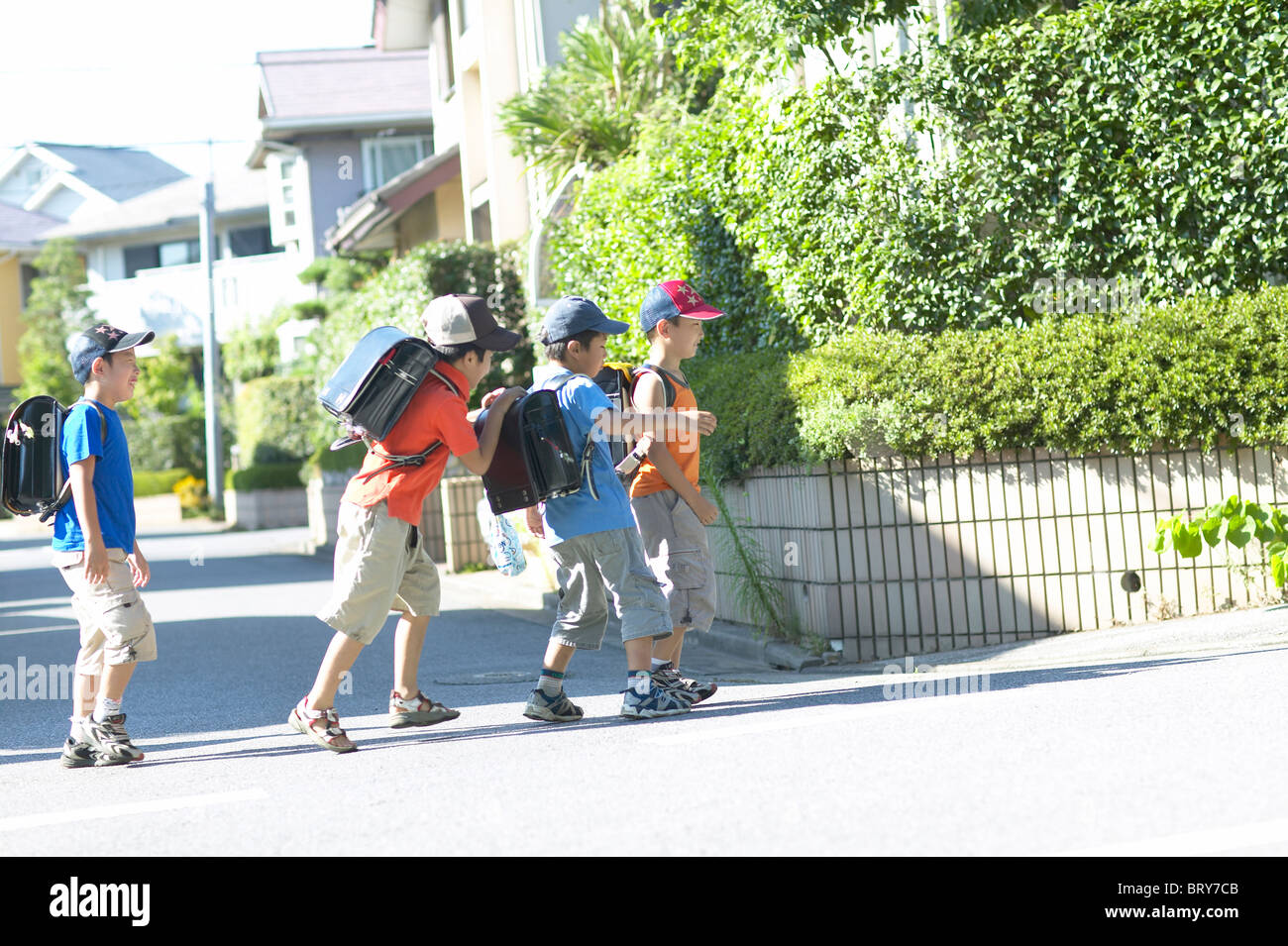Schoolboys walking on street Stock Photo - Alamy