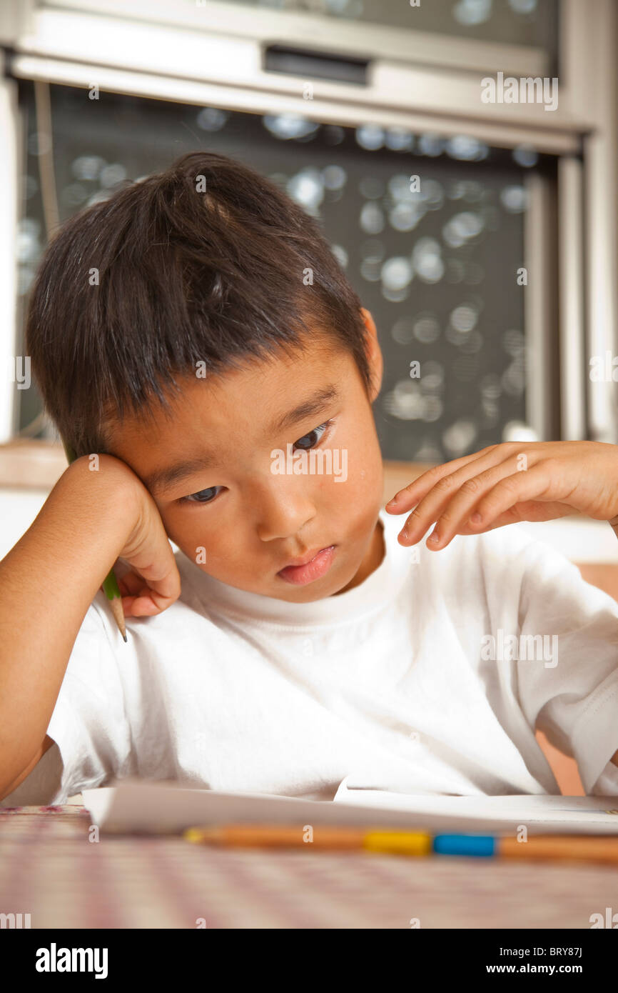 Boy doing homework, Japan Stock Photo - Alamy