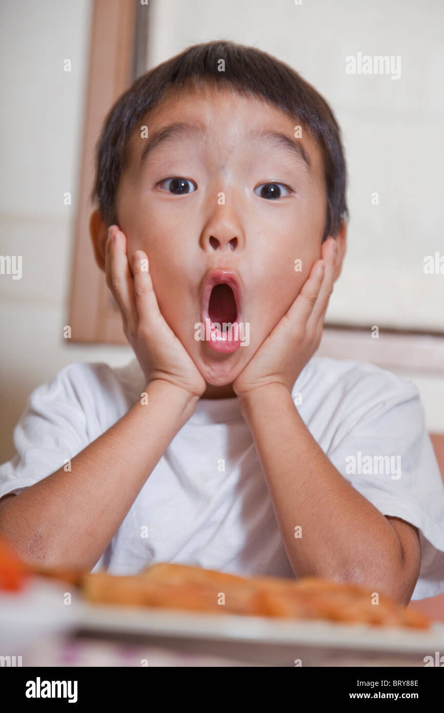 Boy looking surprised, Japan Stock Photo - Alamy
