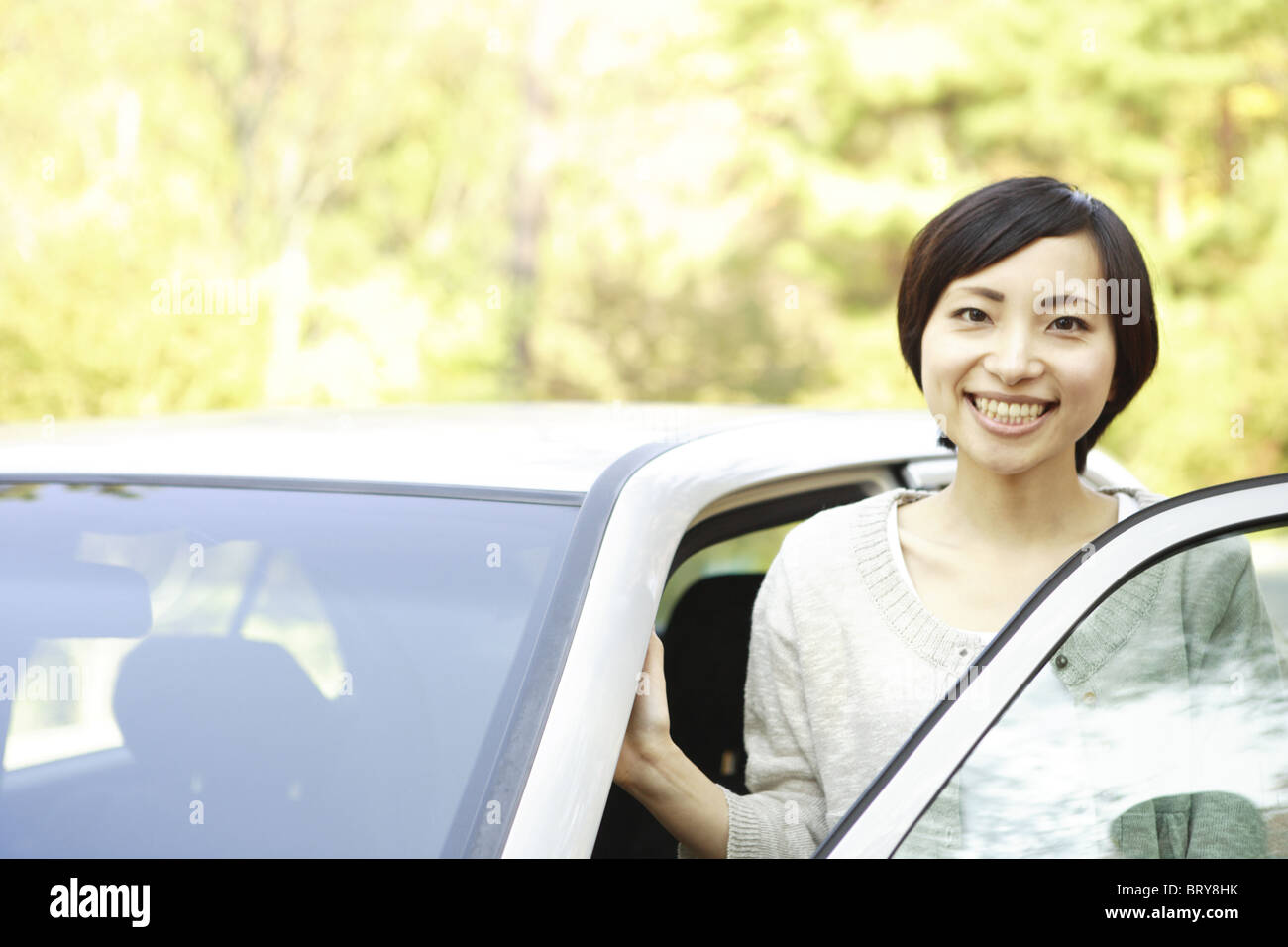 Young Woman Standing by the Car Stock Photo - Alamy