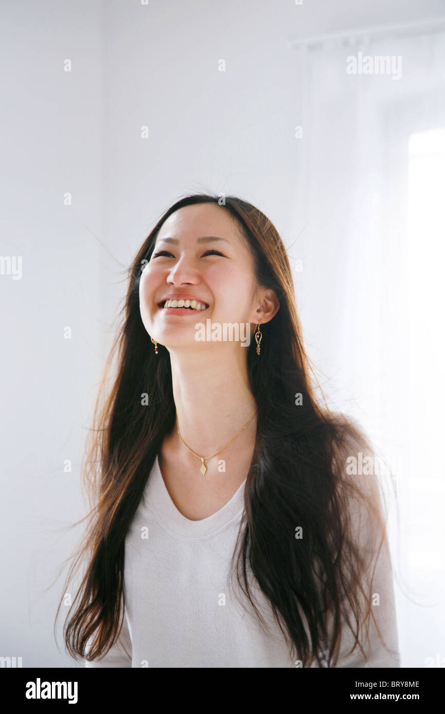 Young Woman Smiling Stock Photo - Alamy