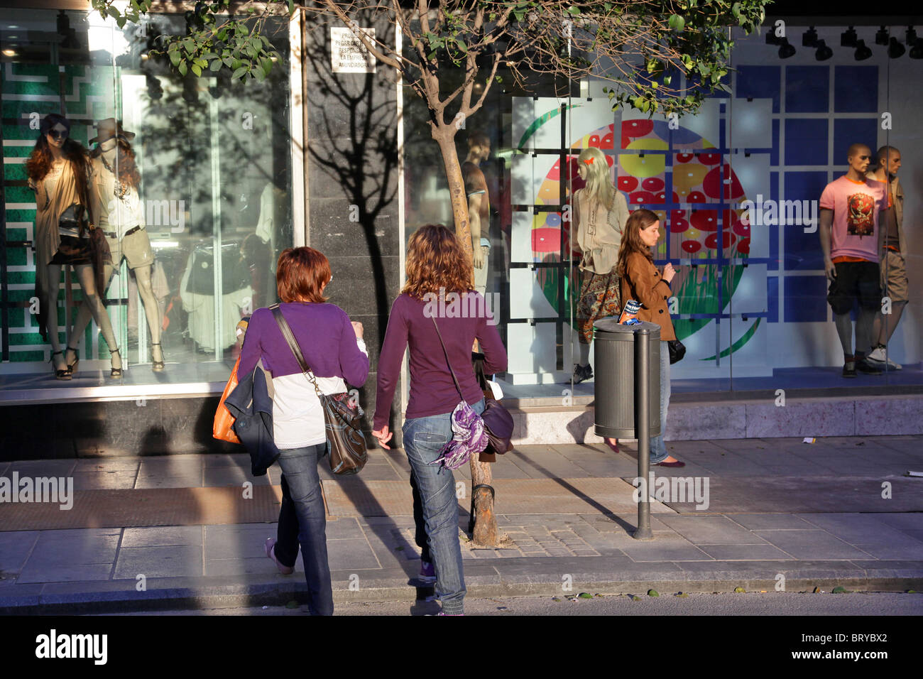 WOMEN IN FRONT OF THE CLOTHING SHOPS ON THE CALLE FUENCARRAL STREET ...