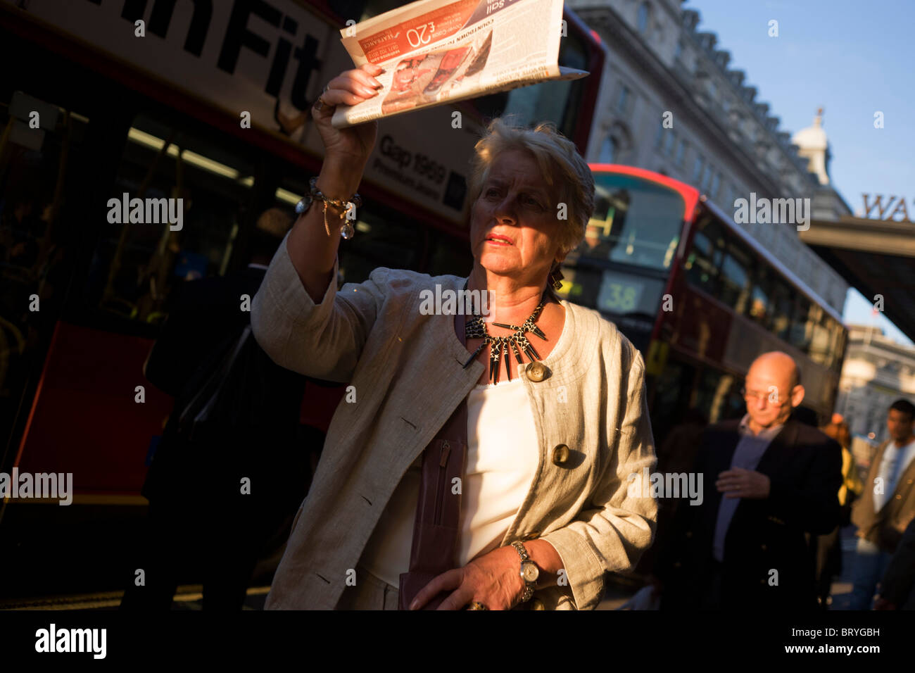 Woman shielding eyes from light hi-res stock photography and images - Alamy