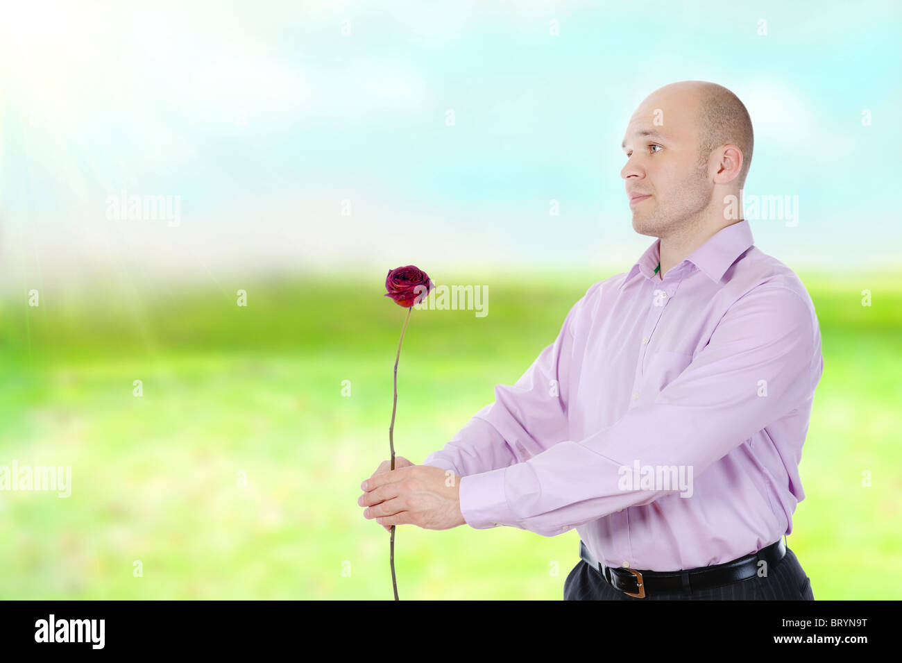 man with a flower in her hand Stock Photo - Alamy