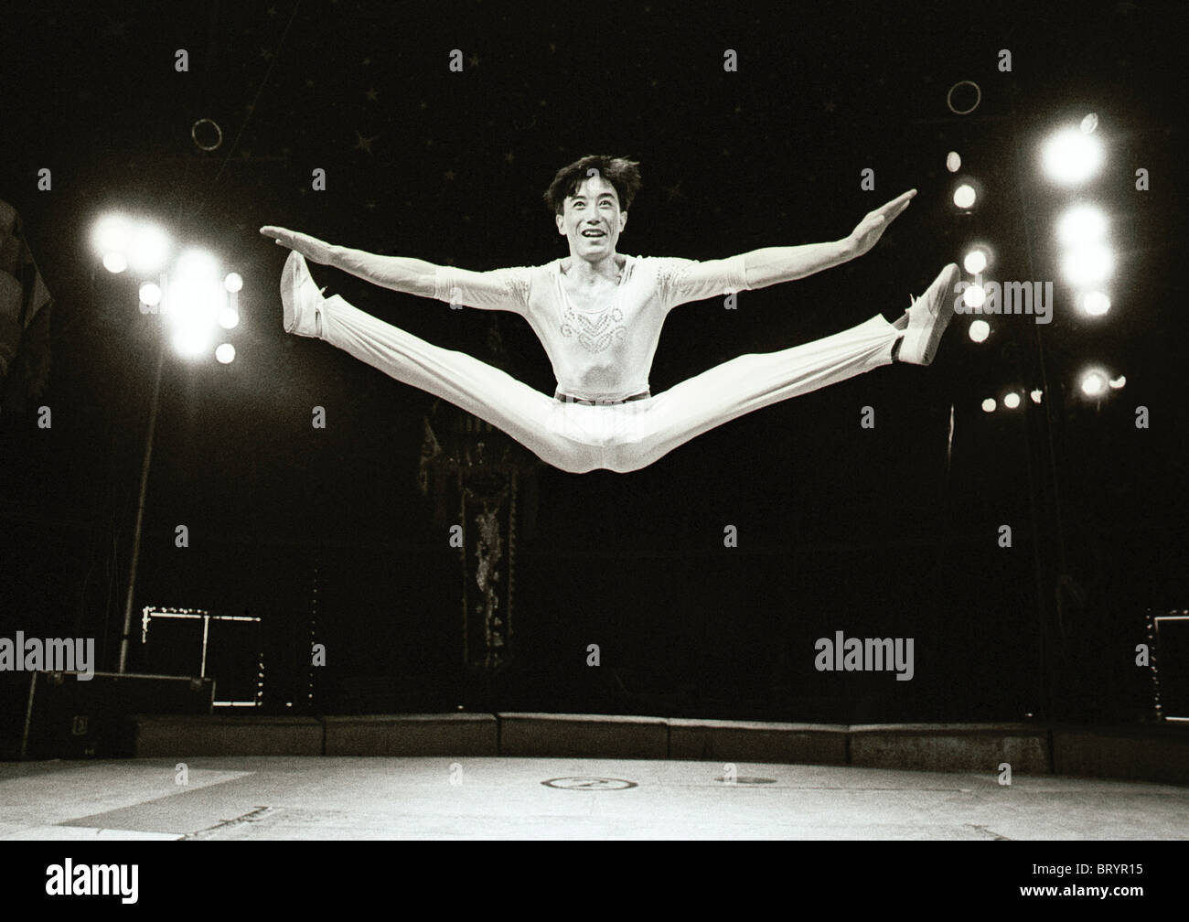 A member of The Chinese State Circus practising gymnastics before a ...