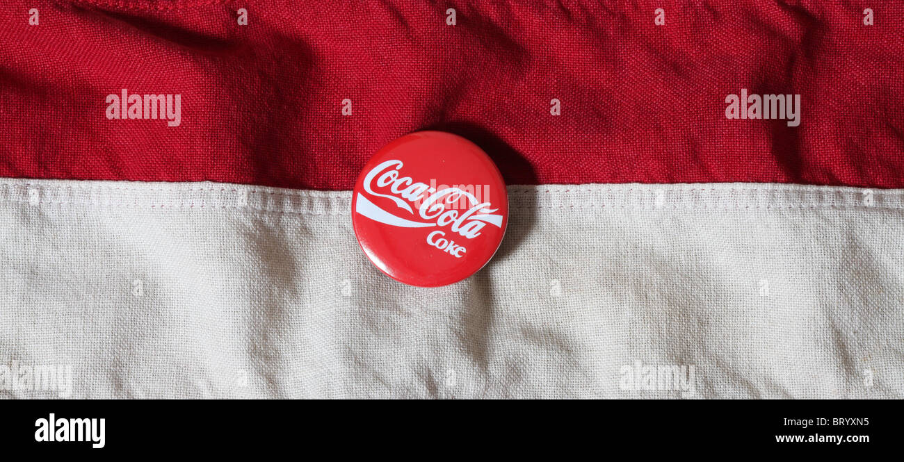 A Coca-Cola badge pinned to an American flag Stock Photo - Alamy