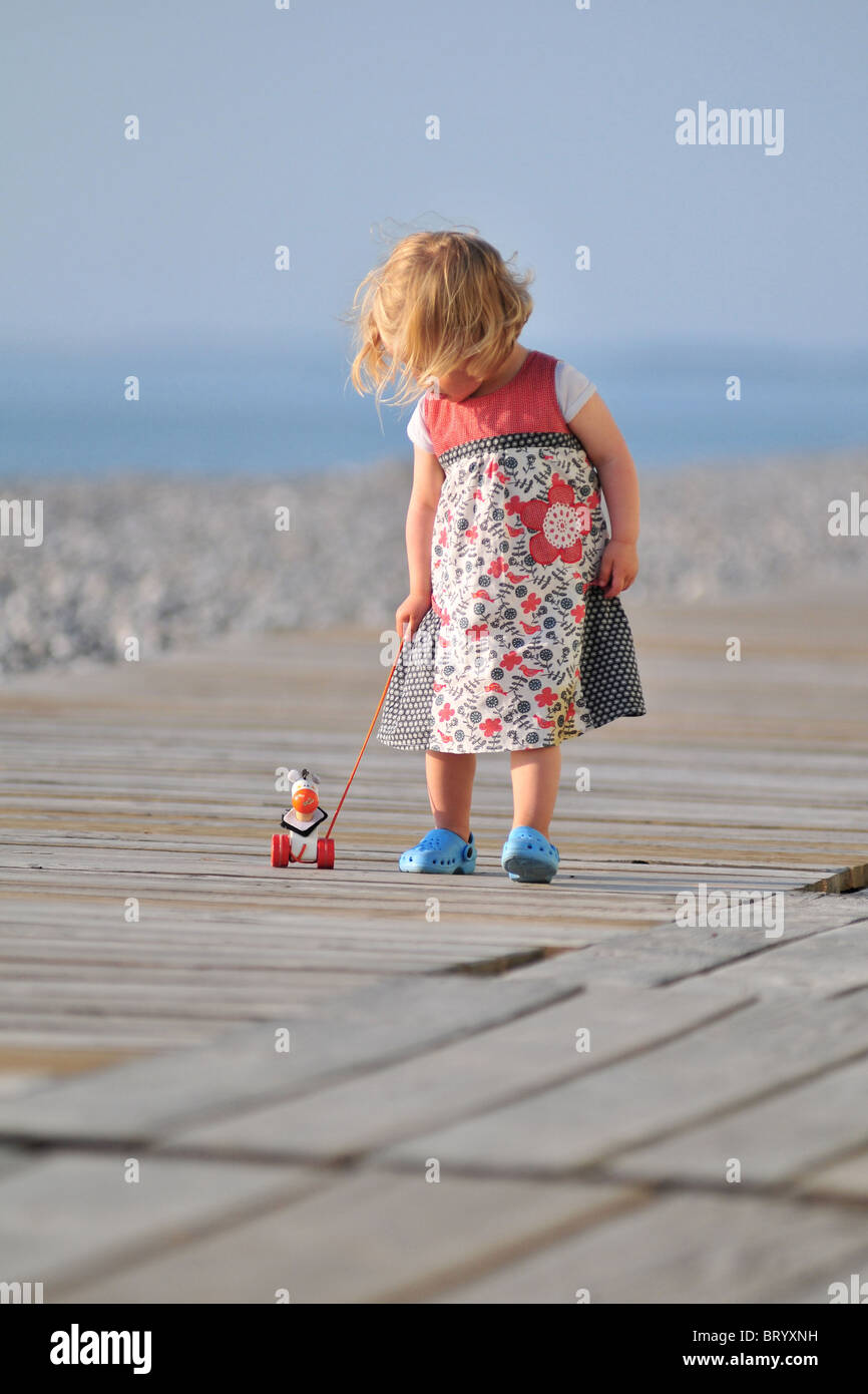 LITTLE GIRL PLAYING ON THE BOARDWALK, SOMME (80), PICARDY, FRANCE Stock ...