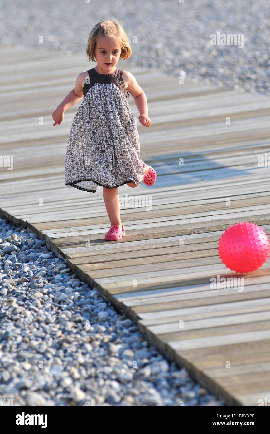 LITTLE GIRL PLAYING WITH A BALL, SOMME (80), PICARDY, FRANCE Stock ...