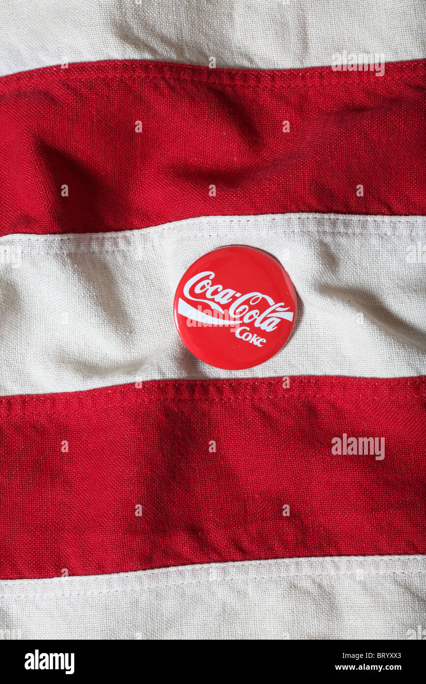 A Coca-Cola badge pinned to an American flag Stock Photo - Alamy
