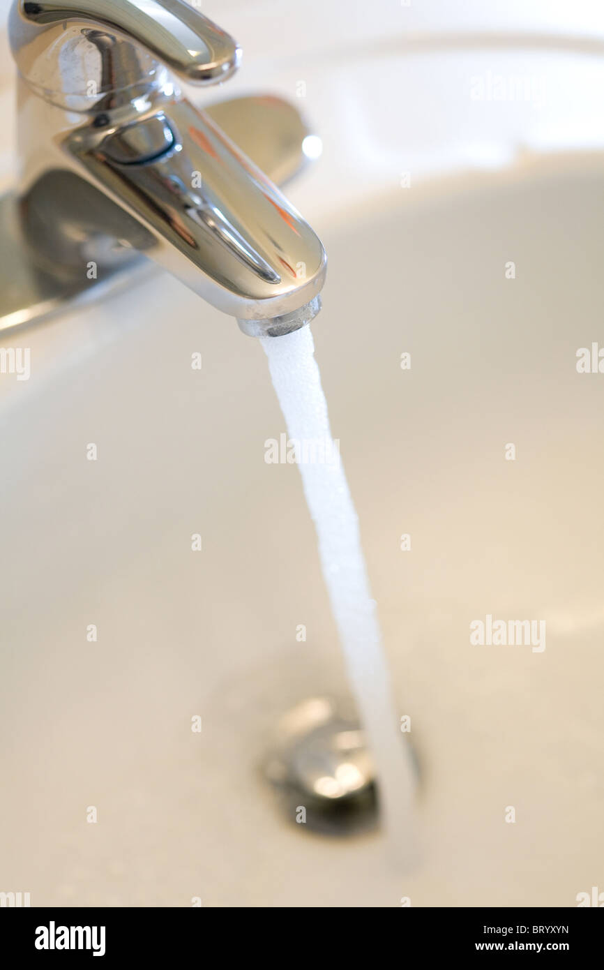water Faucet /tap and Running Water close up shot Stock Photo - Alamy