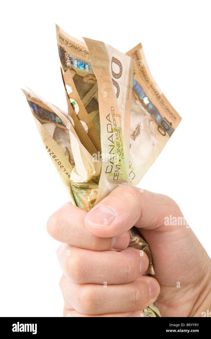 a hand full of canadian dollars, financial concept Stock Photo - Alamy