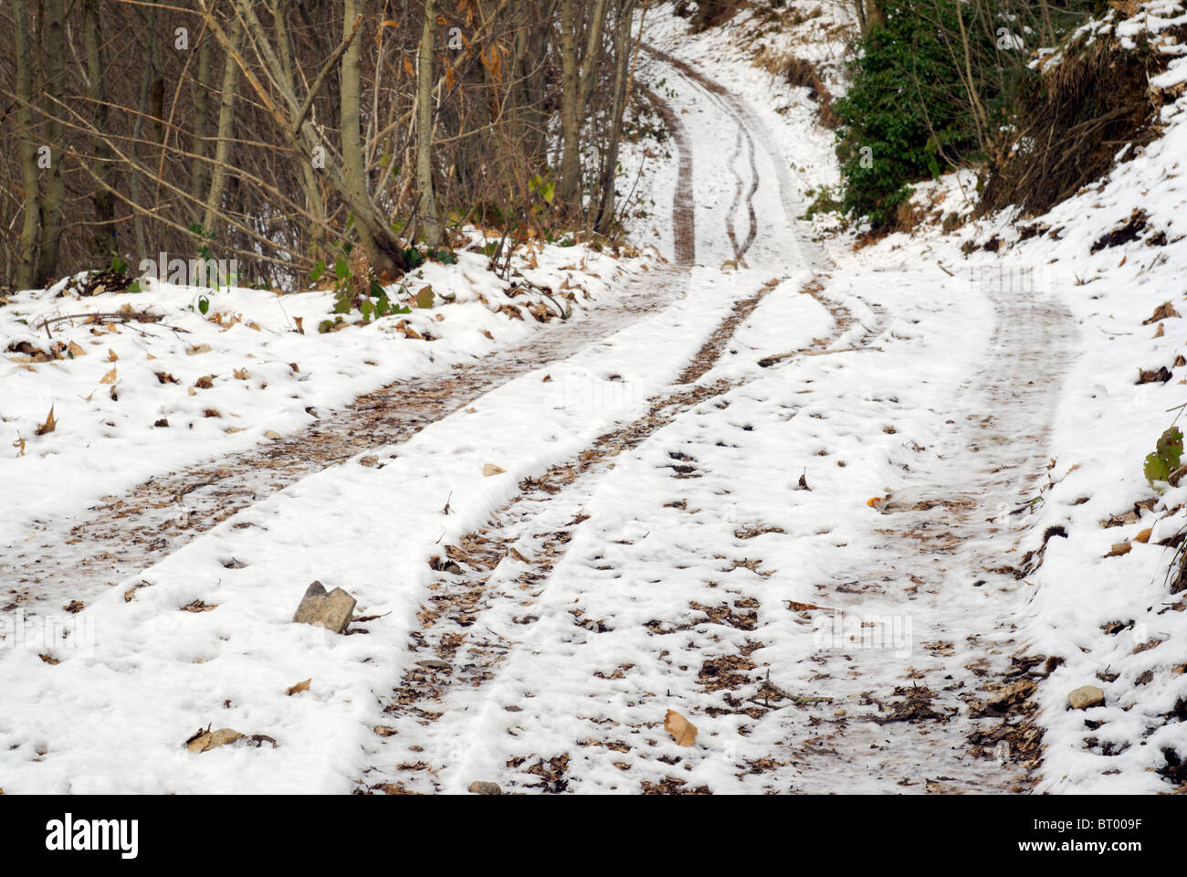 Hill trail with snow Stock Photo - Alamy
