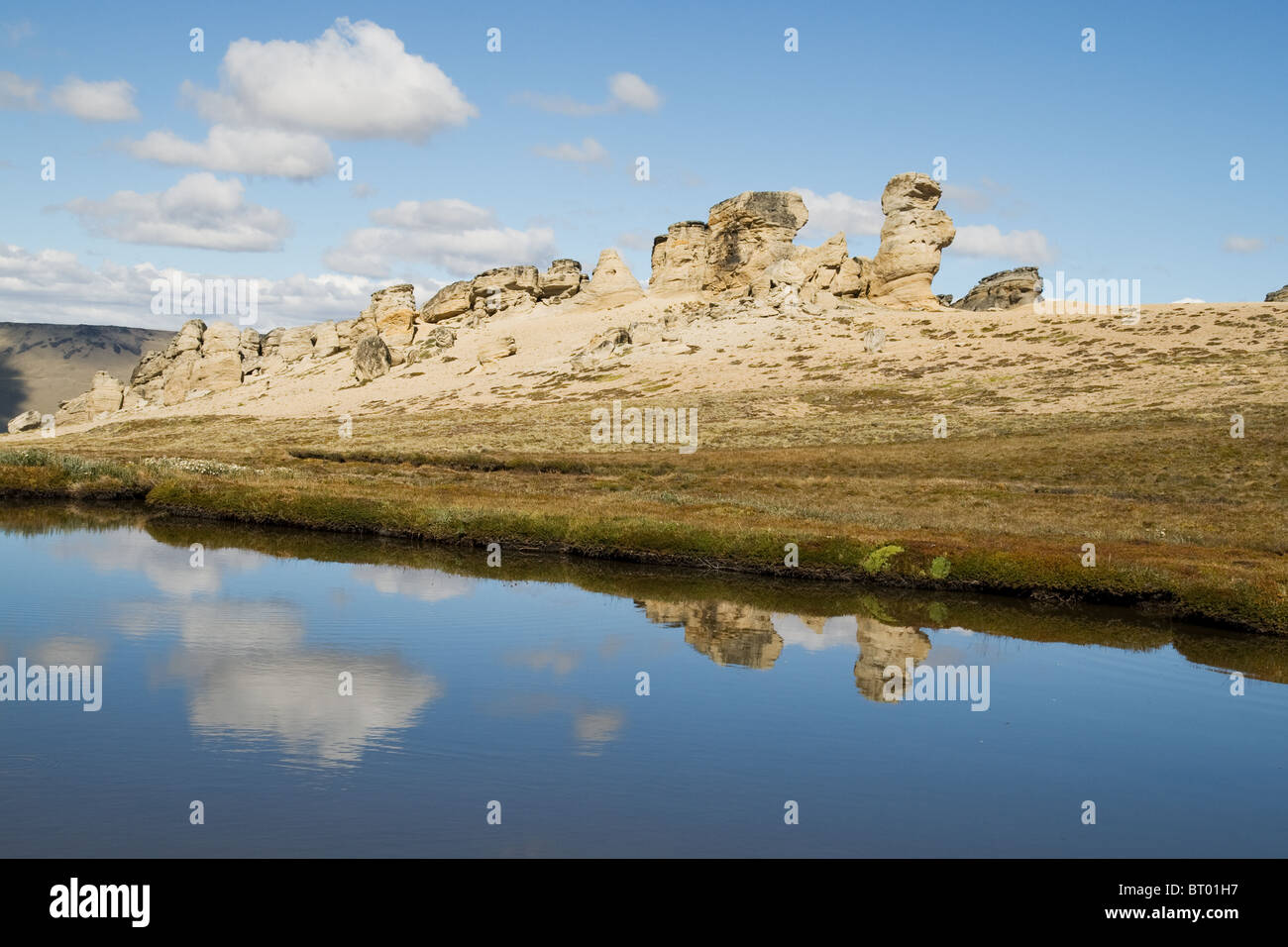 Strange rock formations Huyliche mountain reflected in a lake Stock ...