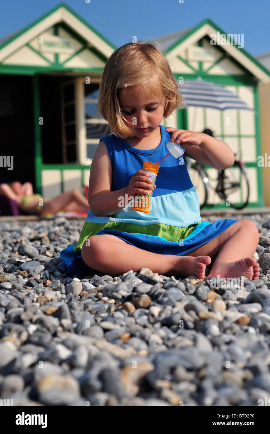 LITTLE GIRL PLAYING WITH PEBBLES, SOMME (80), PICARDY, FRANCE Stock ...
