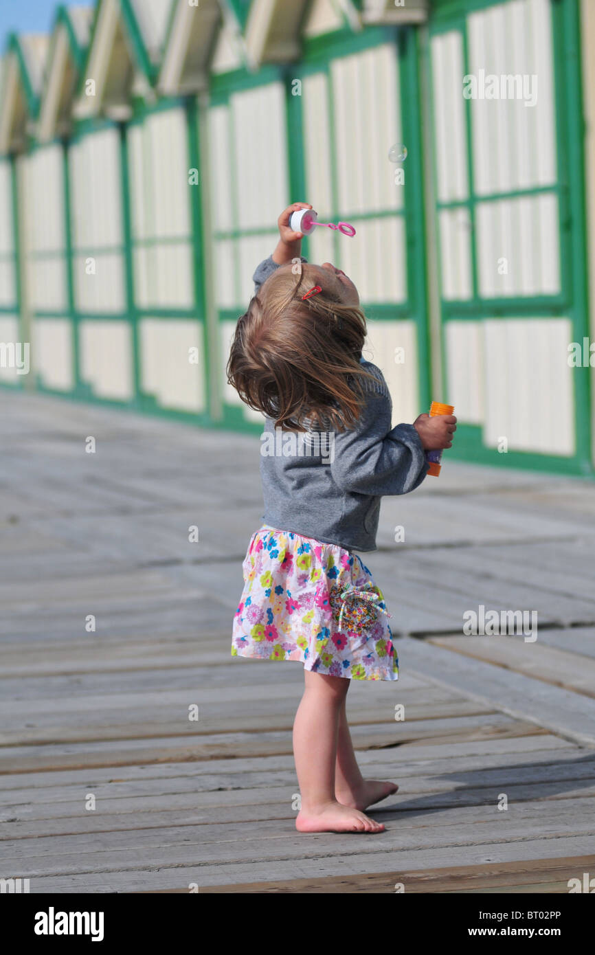 LITTLE GIRL PLAYING ON THE BOARDWALK, SOMME (80), PICARDY, FRANCE Stock ...