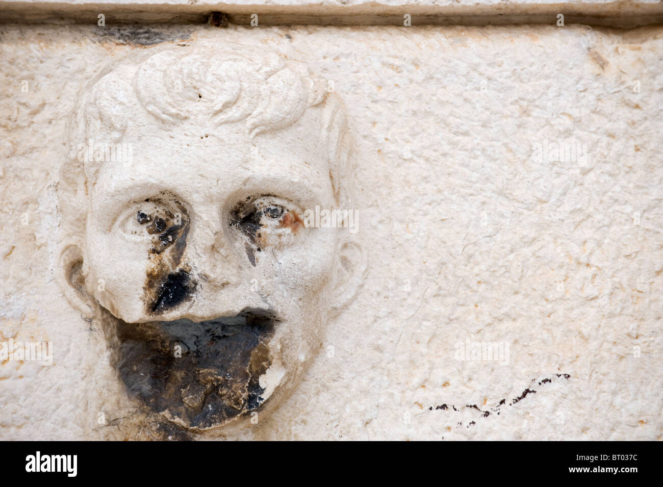 Carving face on rock hi-res stock photography and images - Alamy