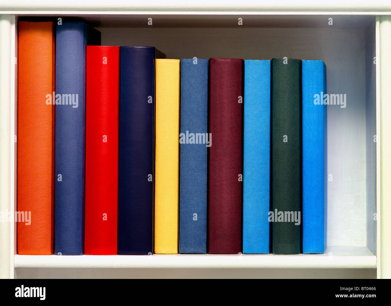 a book shelf stocked with reading books Stock Photo - Alamy