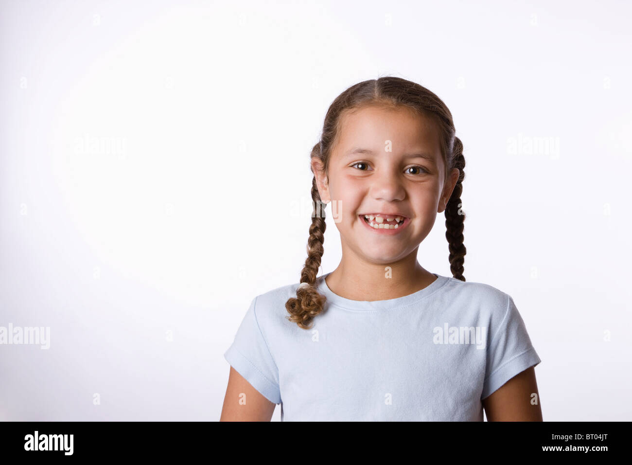 Studio portrait of girl (8-9 Stock Photo - Alamy