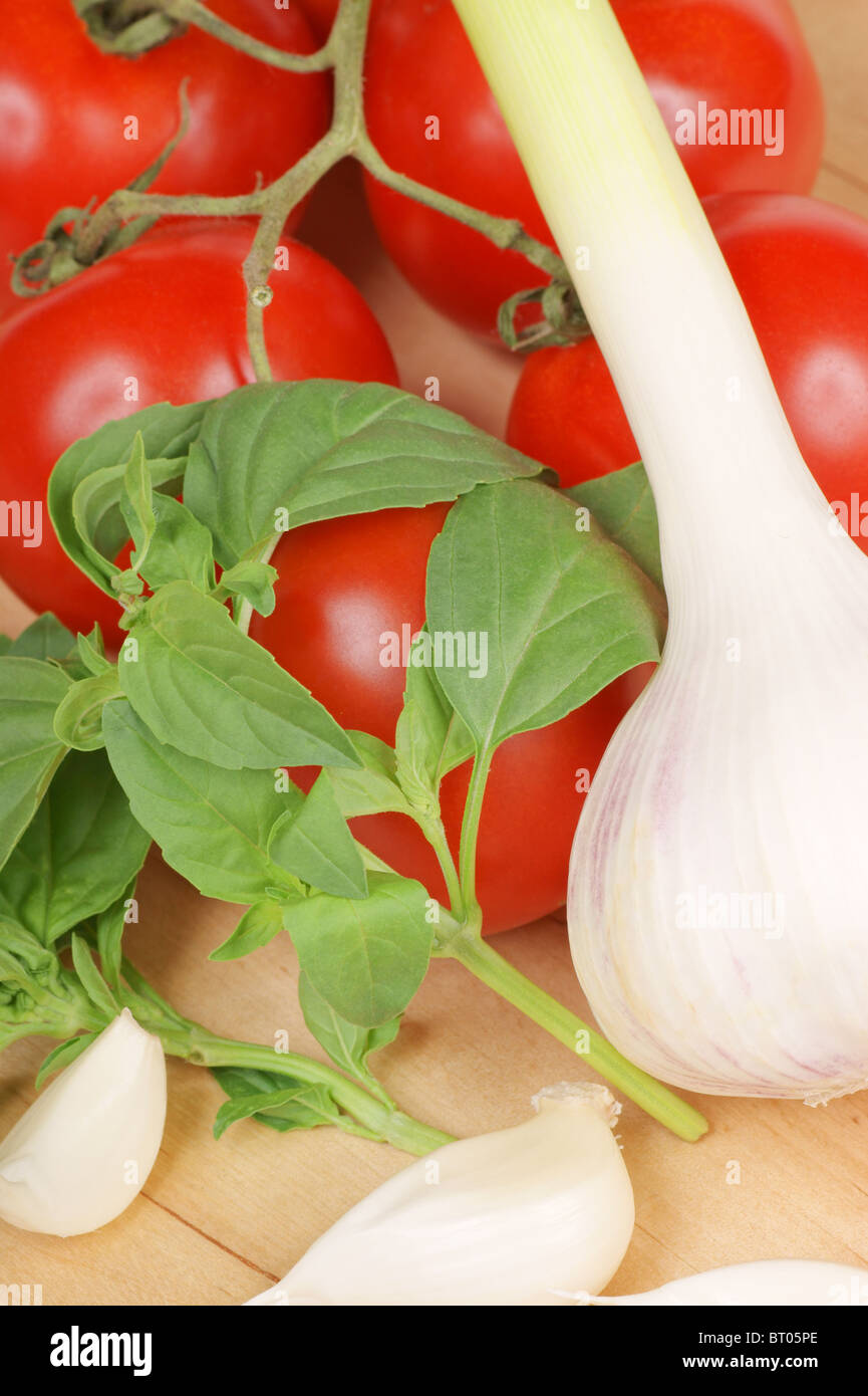 Typical ingredients of italian cuisine: basil, garlic and tomatoes ...