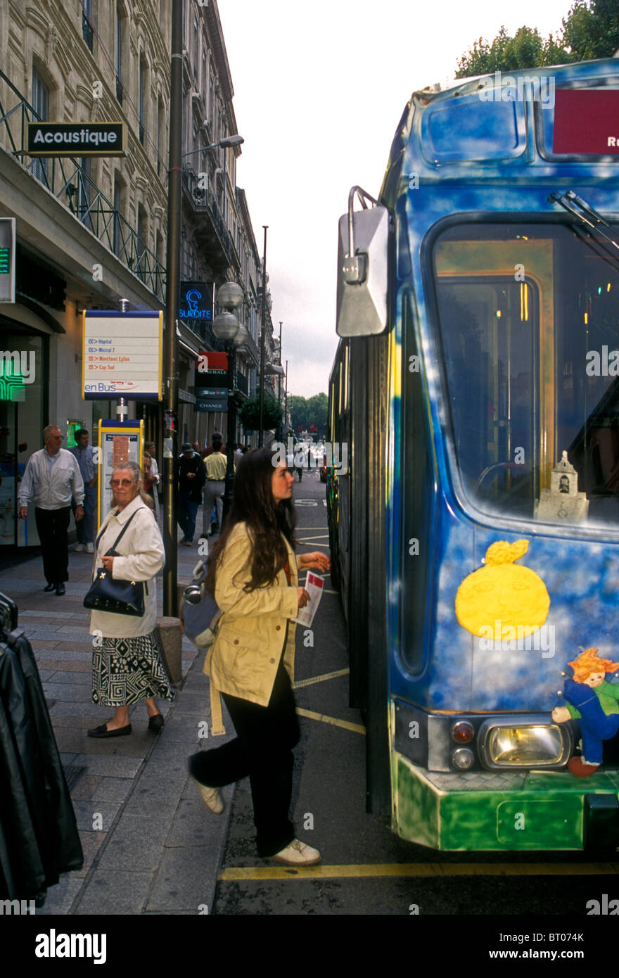 Frenchwoman, French woman, boarding bus, bus stop, city of Avignon ...