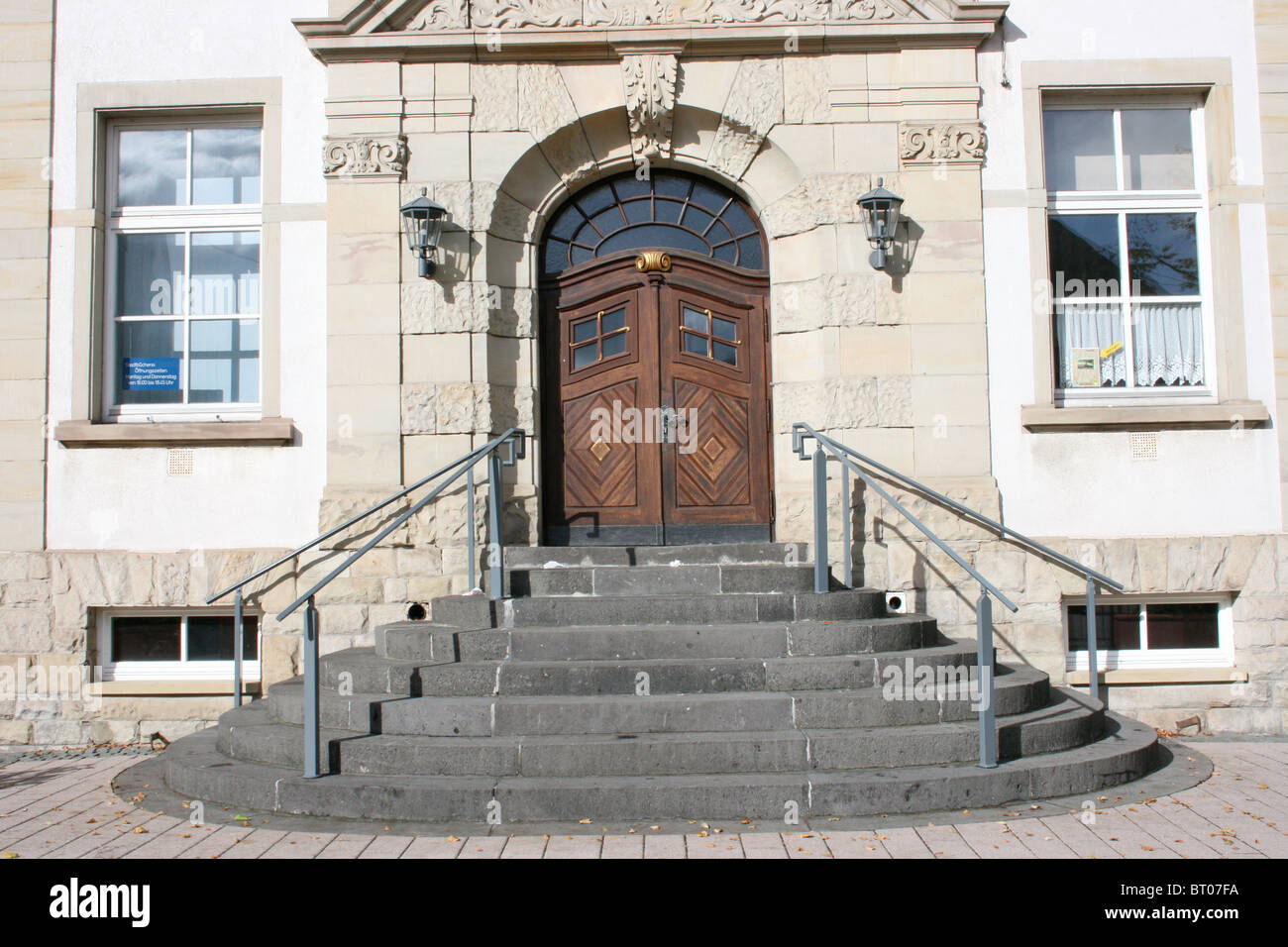 beautiful wood front door with a staircase Stock Photo - Alamy