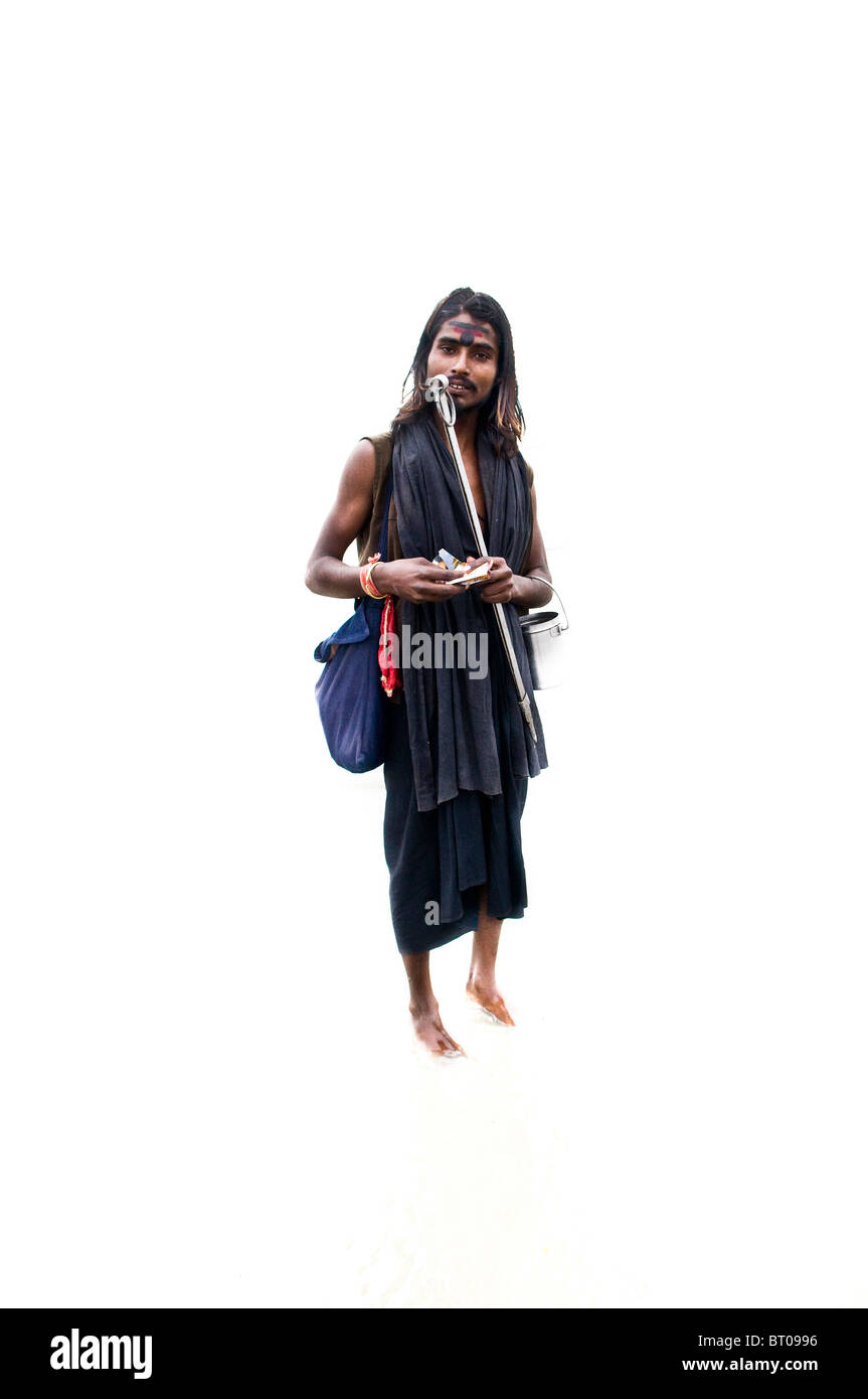 Sadhu hindu holy man walking Cut Out Stock Images & Pictures - Alamy