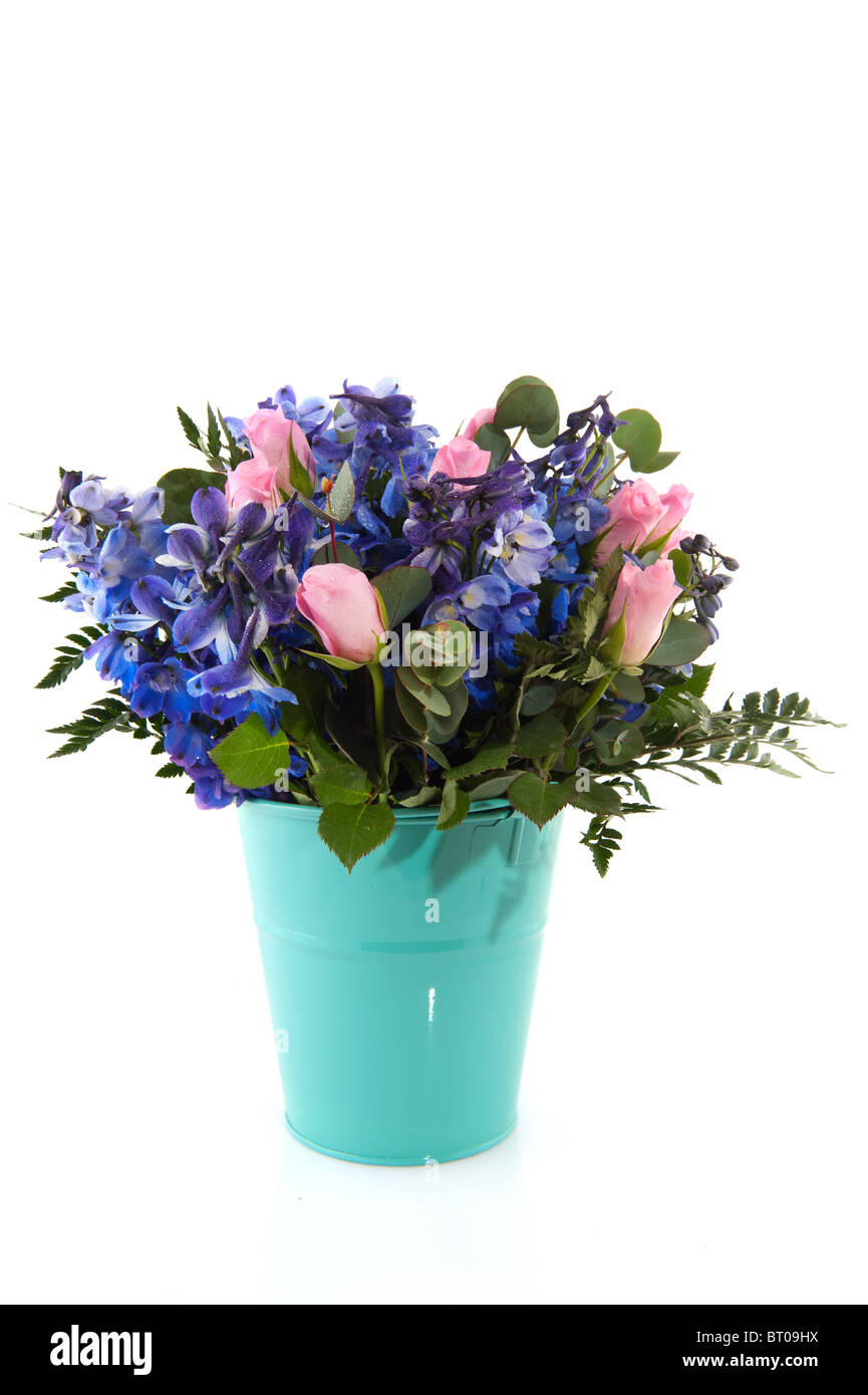 Bouquet in bucket with pink and blue flowers Stock Photo - Alamy
