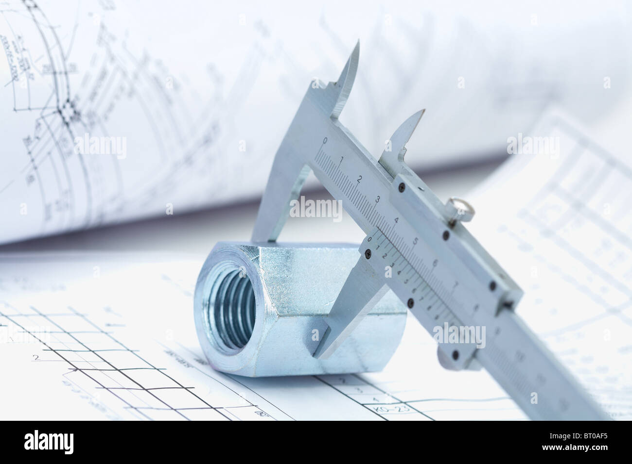 Image of architectural ruler over nut with house project near by Stock ...