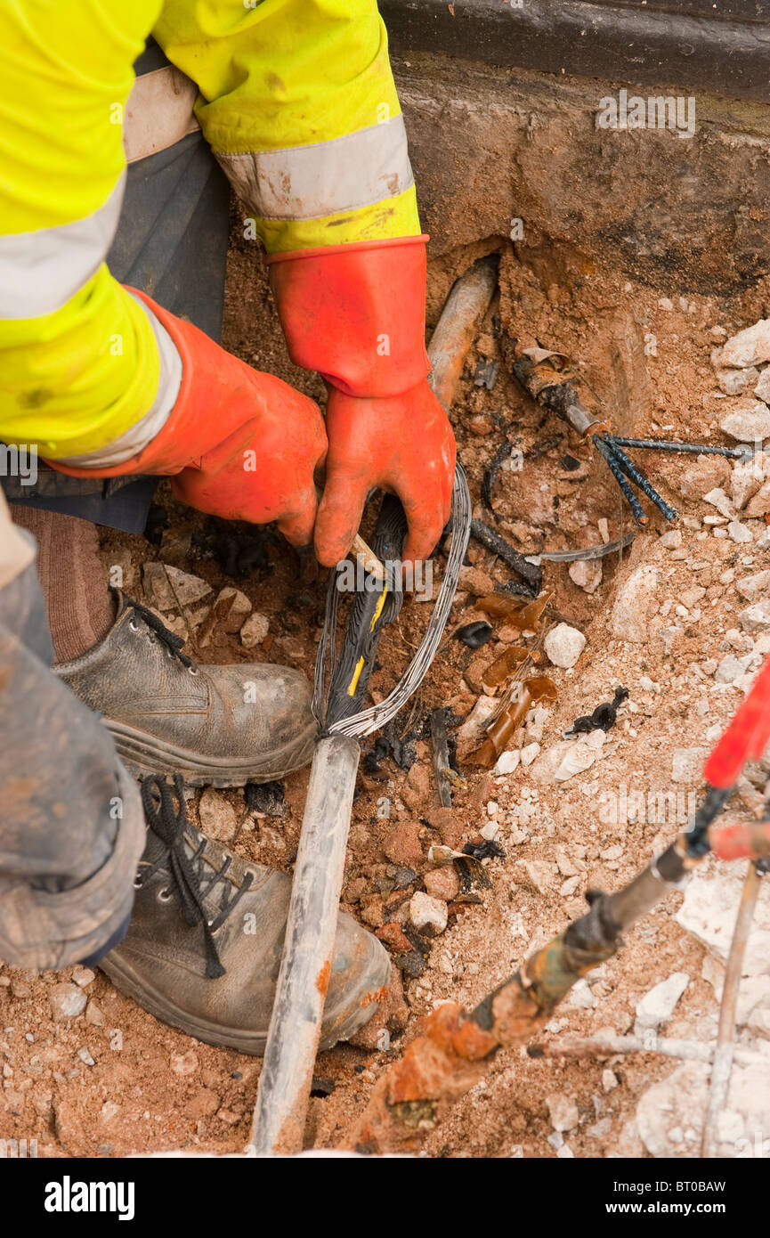 Underground steel armoured high voltage cable being isolated / cut and ...
