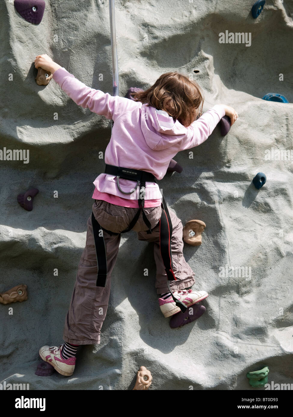 Young girl on climbing wall Stock Photo - Alamy