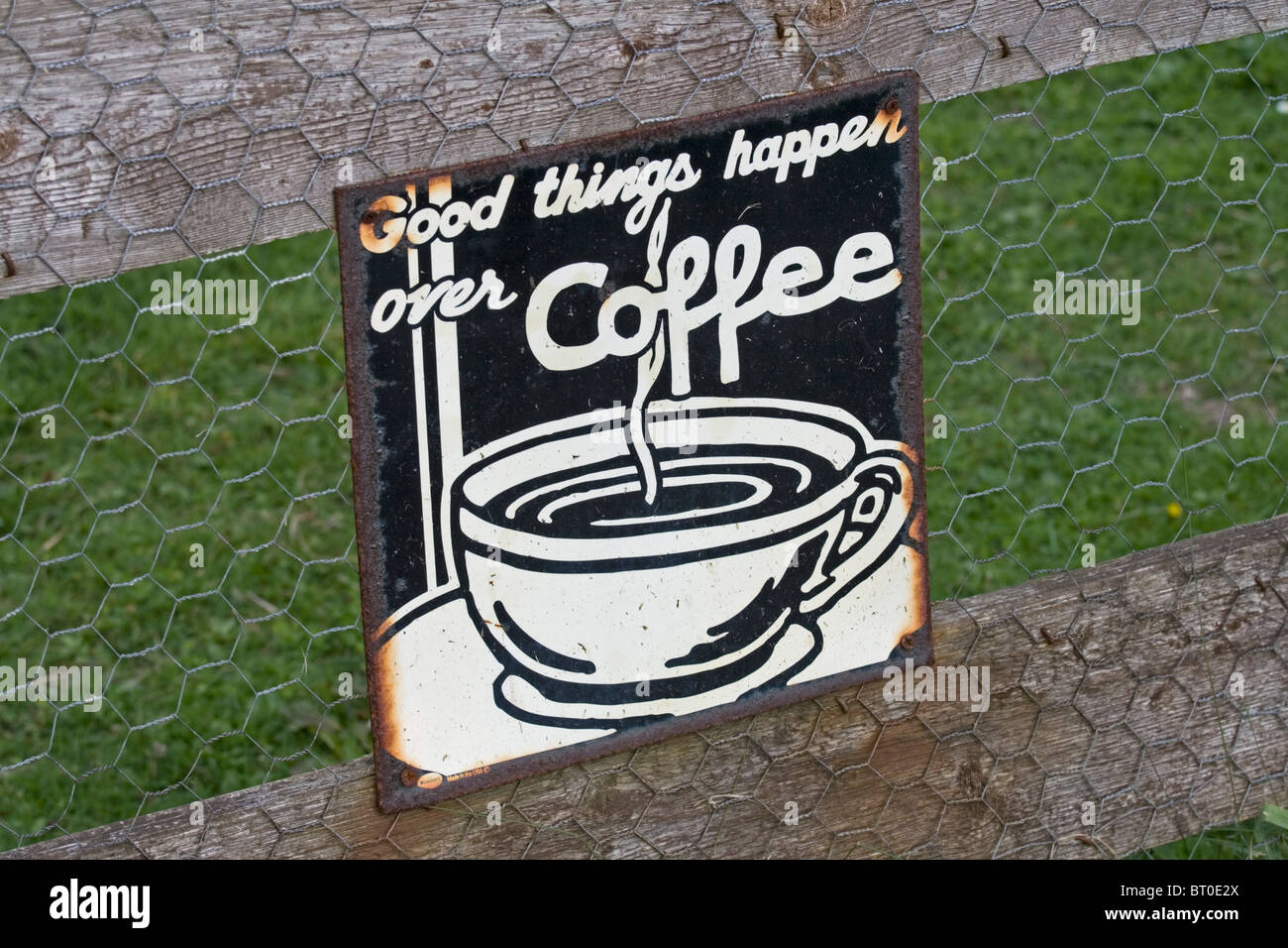 Old and weathered metal sign advertising coffee Stock Photo - Alamy